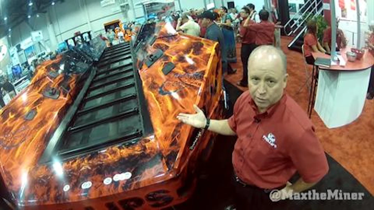 Phillips gets a visit from Max the Miner at MINExpo 2012 | OEM Off-Highway